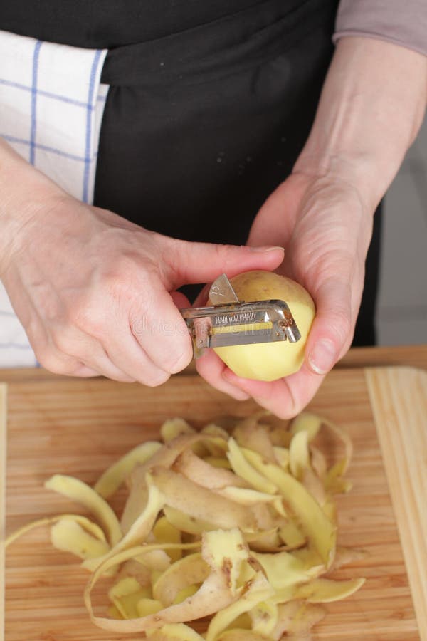 Peeling Potato stock photo. Image of food, cuttingboard - 28449818