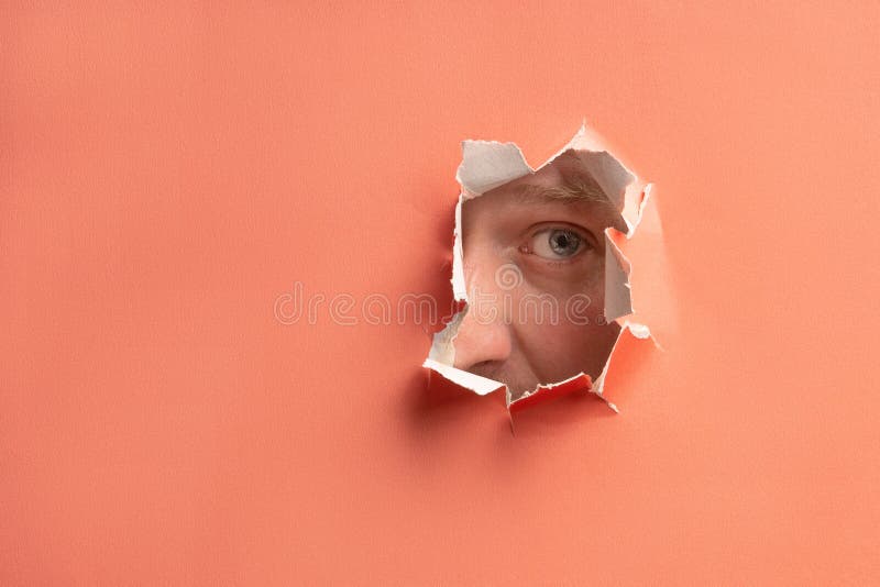 Peep through Torn Paper, Look through a Hole in Paper Stock Photo ...