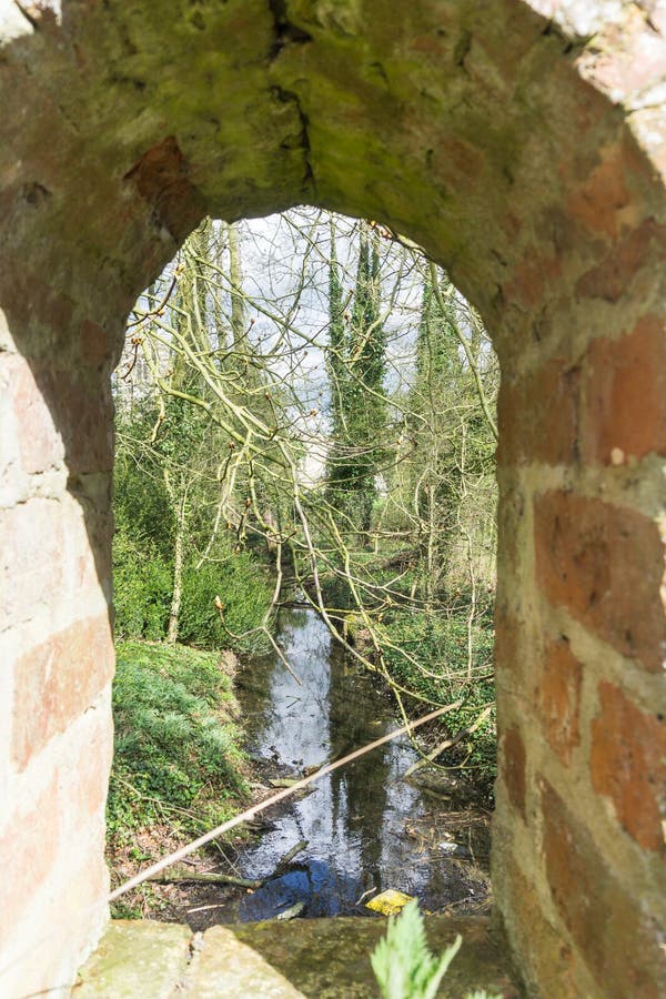 Peeping through a Brick Archway into View of the Countryside Stock ...