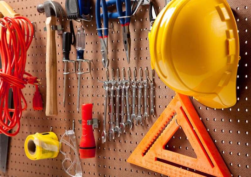 Peg Board with Tools and Hard Hat Stock Photo - Image of supplies ...