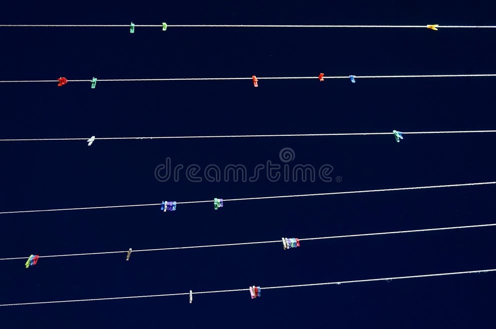 Pegs on Strings Against the Sky Stock Image - Image of line, clothespin ...