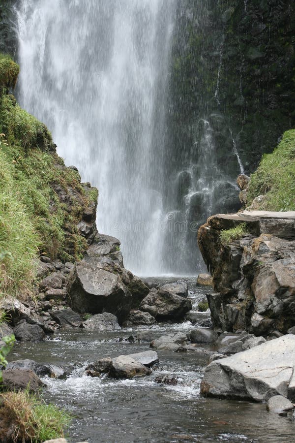 Peguche Falls Framed by Rocks Stock Photo - Image of outdoor, cascade ...
