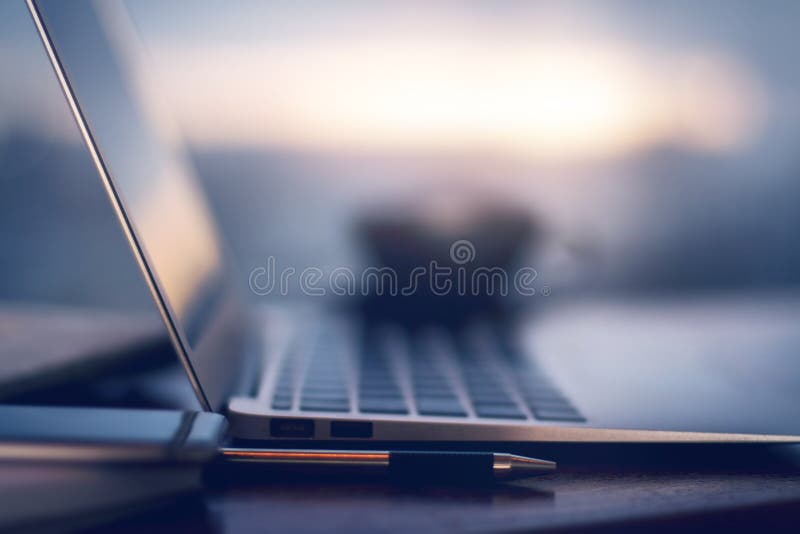 Pen and blurry laptop stock photo. Image of abstract - 68898812