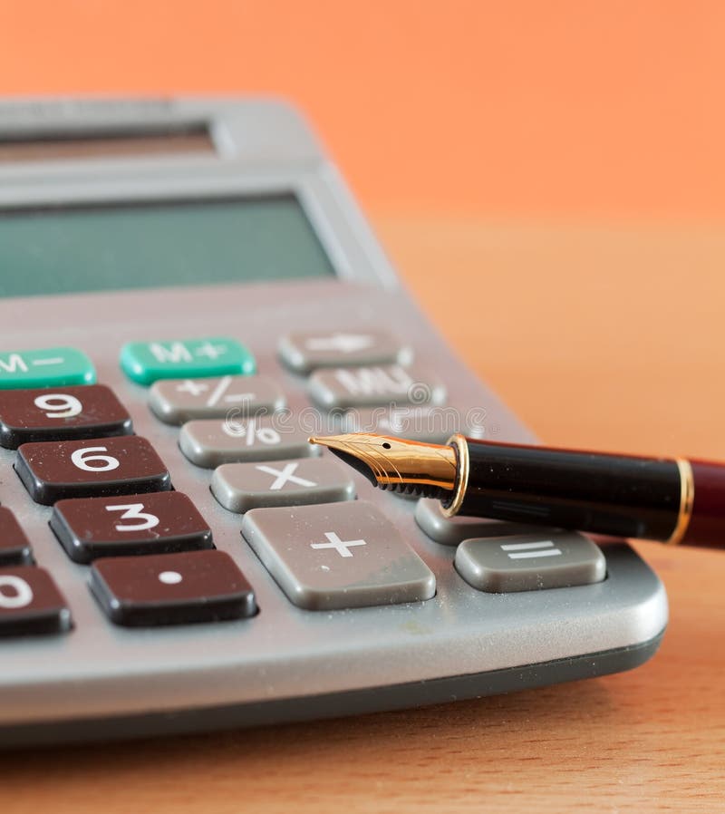 Pen and calculator stock photo. Image of table, office - 86582688