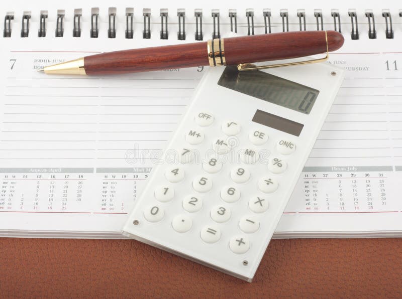 Pen and Calculator on Open Diary Notepad Stock Photo - Image of brown ...