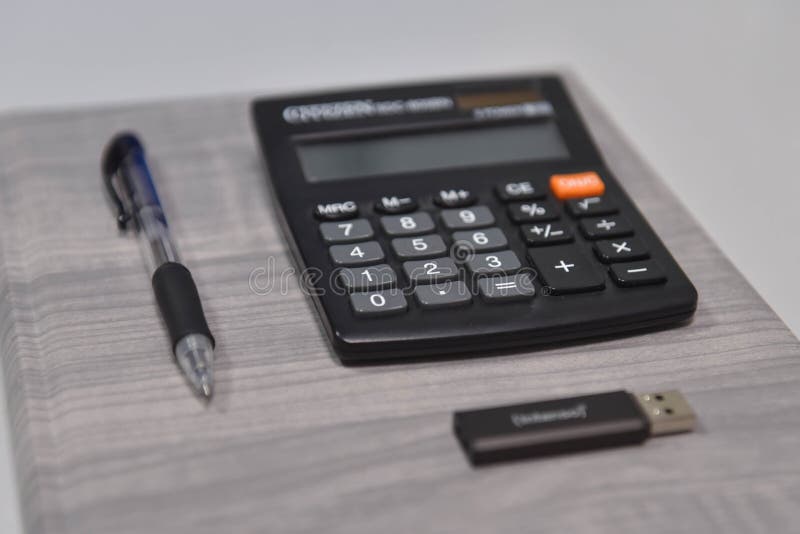 Pen, Calculator and Usb Stick in the Office Stock Image - Image of ...