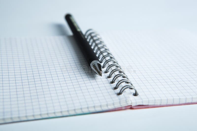 Pen on the Checkered Paper Notebook Stock Photo - Image of macro ...