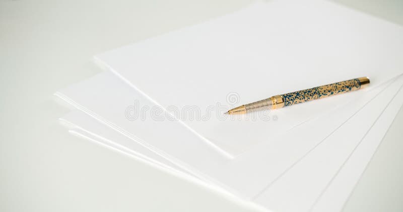 A Pen on Clean White Blank Sheets of Paper Stock Photo - Image of ...