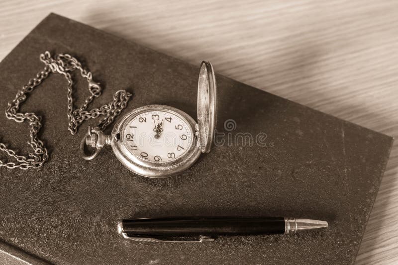 Pen and clock on books. stock photo. Image of envelope - 56890318