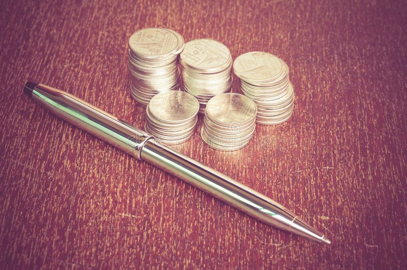 Pen and coins stock photo. Image of exchange, refill - 60989062
