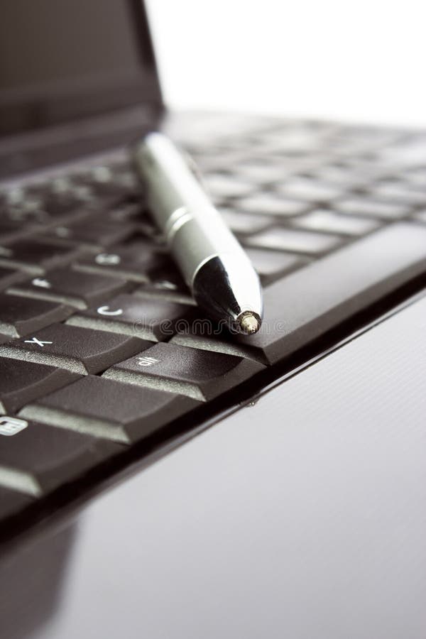 Pen on computer keyboard stock image. Image of data, digits - 34792123