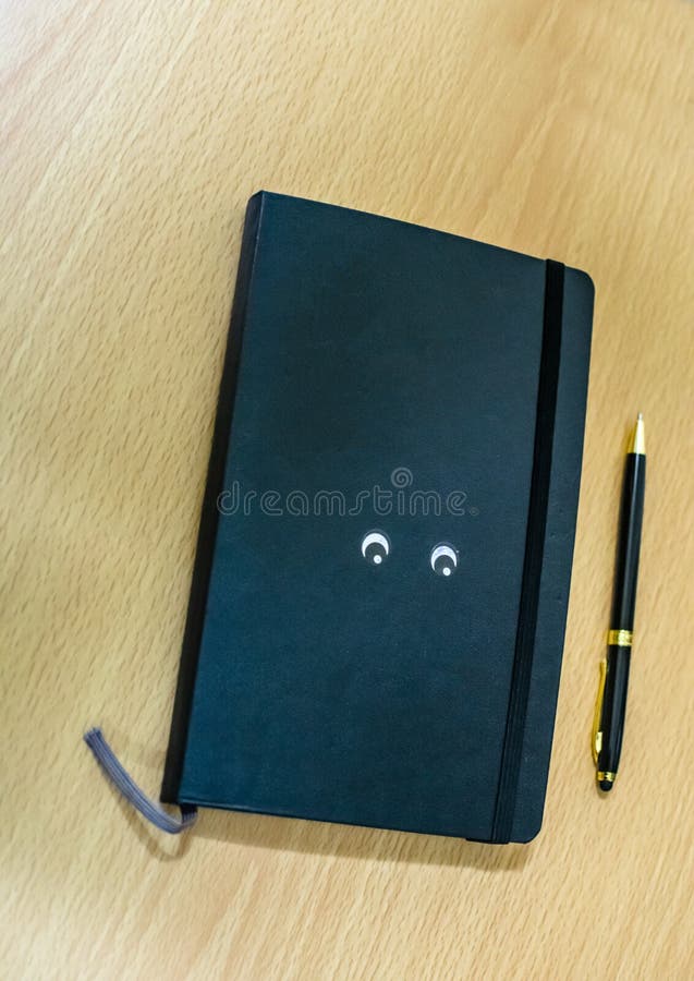 A Pen and Diary Book on a Table Stock Image - Image of school ...