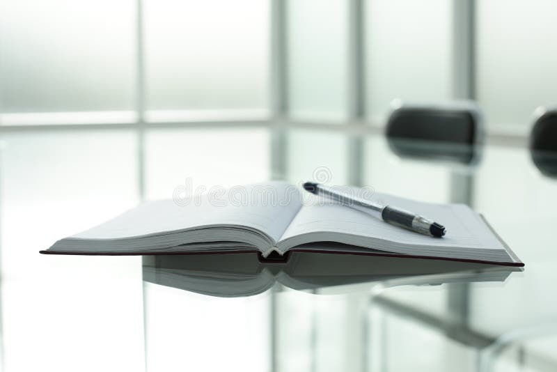 Pen Diary on Glass Table in Spacious Office Stock Image - Image of ...