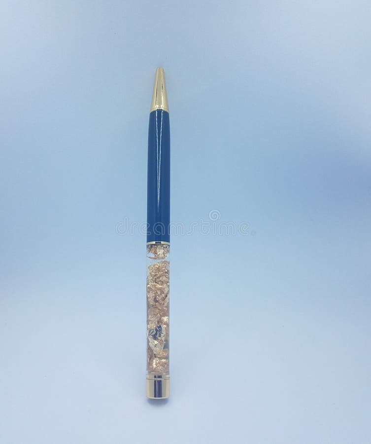 Pen with Gold Flakes or Nuggets on White Background Stock Image - Image ...