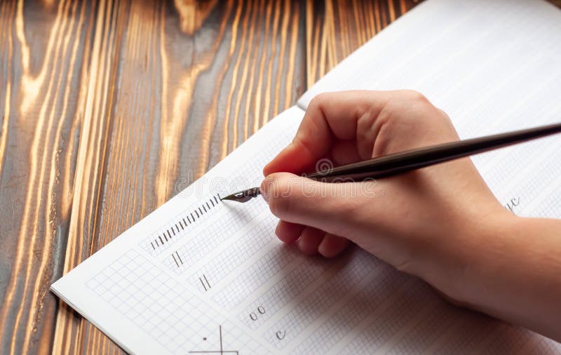 Pen in Hand and Notebook on the Table Stock Image - Image of pencil ...