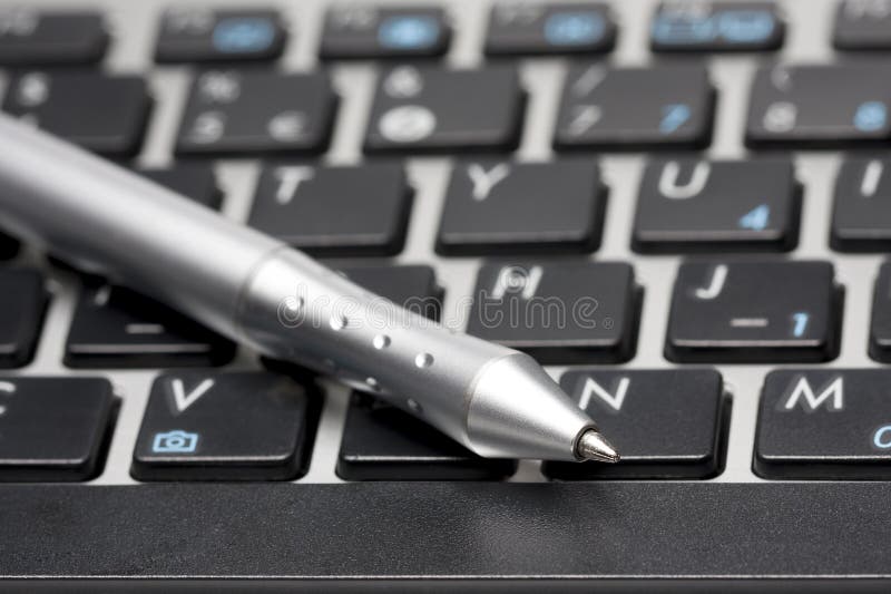 Pen on keyboard editorial photo. Image of keys, orange - 1427496