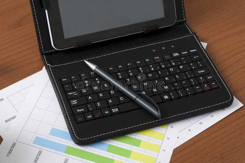 Pen on the keyboard stock photo. Image of chart, pencil - 34249452