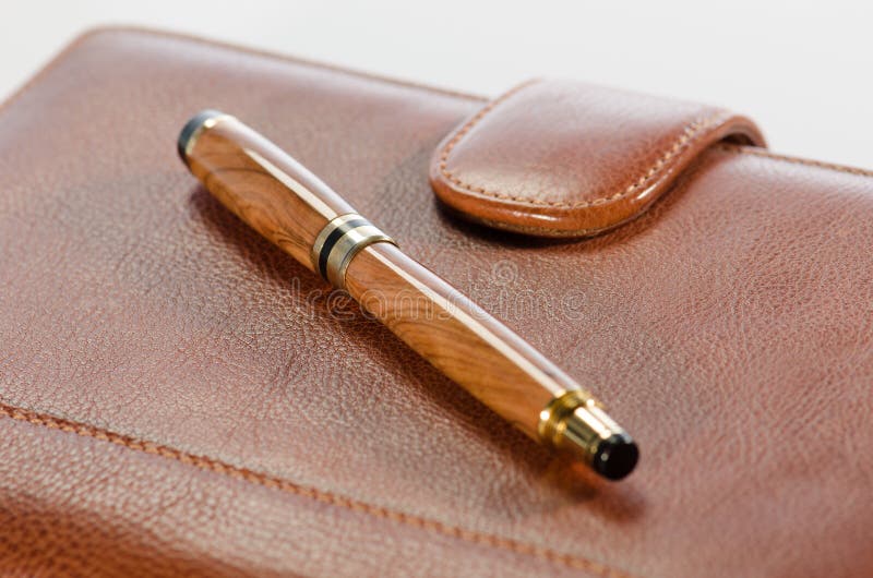 Pen and leather notebook stock image. Image of black - 26507709