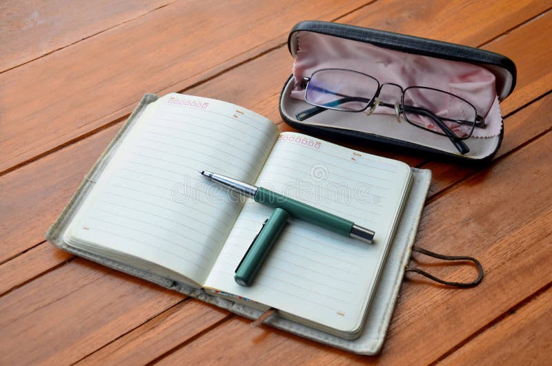 Pen on Note Book and Spectacles Glasses Stock Image - Image of lens ...