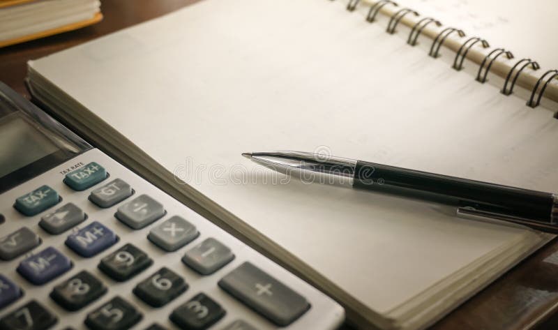 A Pen on a Notebook with a Calculator Stock Image - Image of business ...