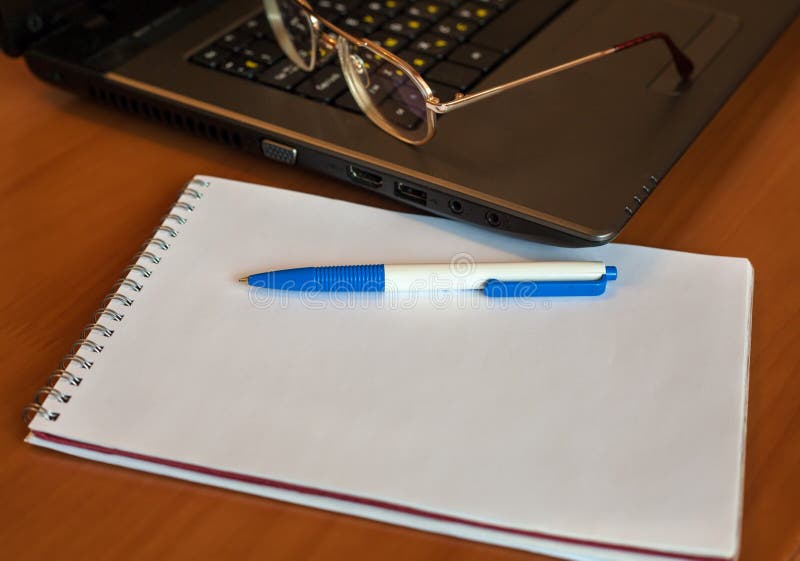 Pen with Notebook and Glasses Near Laptop Stock Image - Image of ...