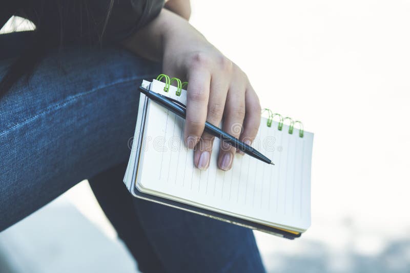 Pen and Notebook in the Hands Stock Photo - Image of student, person ...