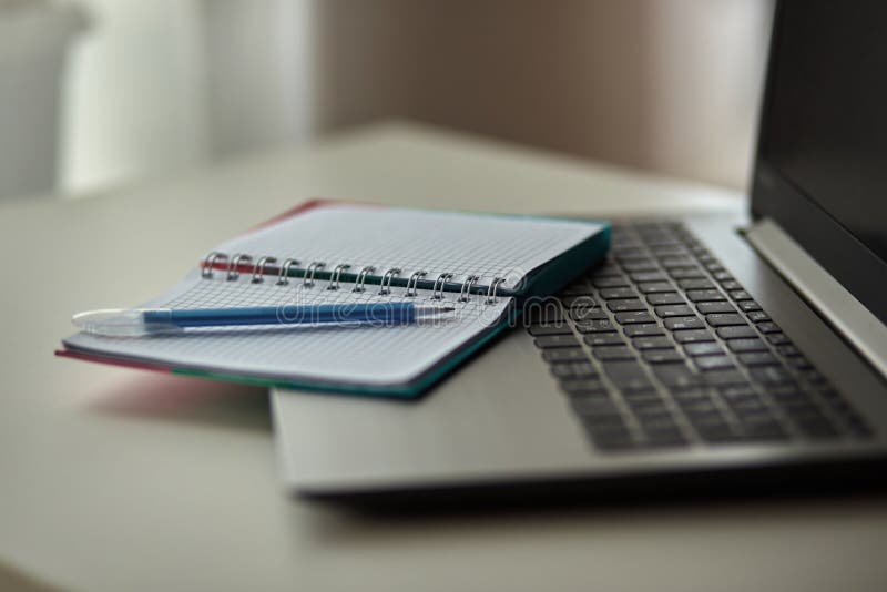 Pen, Notebook on Laptop with Blur Background Stock Photo - Image of ...