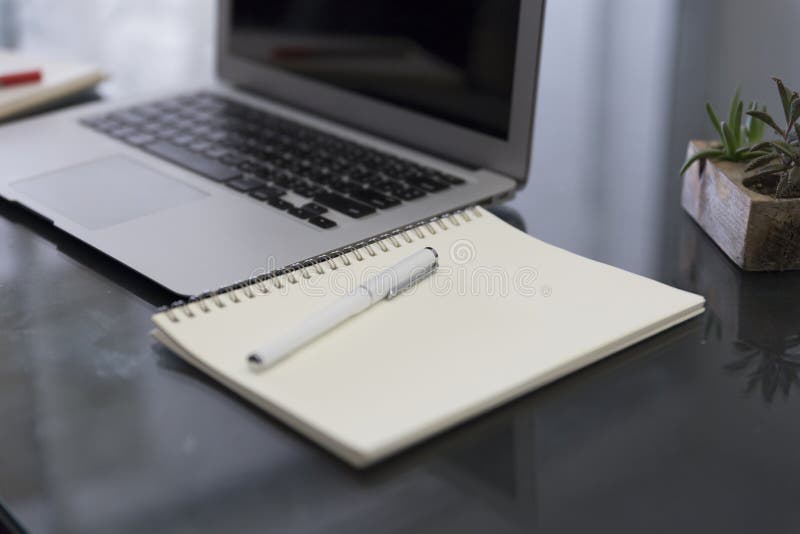 Pen, Notebook and Laptop Computer on Black Table Stock Image - Image of ...