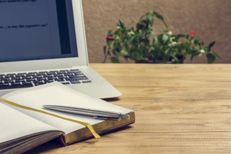 Pen on Notebook and Laptop on Wood Table Stock Photo - Image of online ...