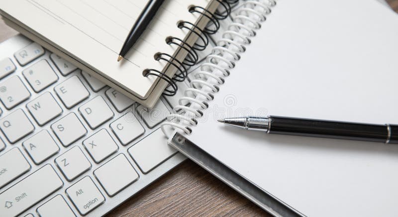 Pen and Notepad on the Computer Keyboard Stock Image - Image of ...