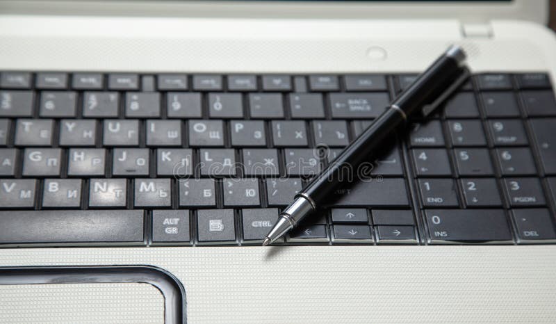 Pen and Notepad on the Computer Keyboard Stock Photo - Image of ...
