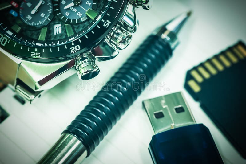 Pen, Notepad, Memory Stick, Memory Card and Men`s Watch on Table Stock ...