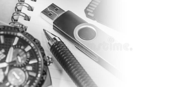 Pen, Notepad, Memory Stick, Memory Card and Men`s Watch on Table Stock ...