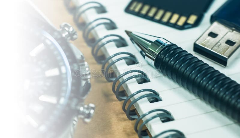 Pen, Notepad, Memory Stick, Memory Card and Men`s Watch on Table Stock ...