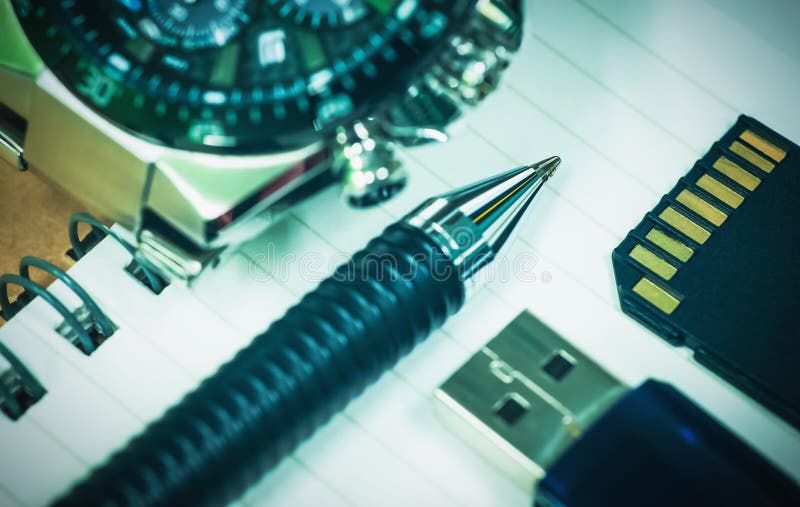 Pen, Notepad, Memory Stick, Memory Card and Men`s Watch on Table Stock ...