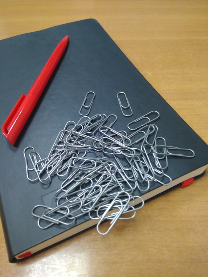 Pen, paper clips, diary. stock photo. Image of round - 129282140