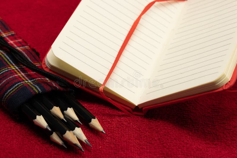 Pen and Pencils with Notepad in Red Background, Office Concept Stock ...