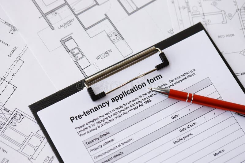 Pen on Pre-tenancy Application Form and Planning Blueprints of ...