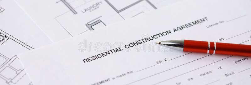 Pen on Residential Construction Agreement and Planning Blueprints of ...
