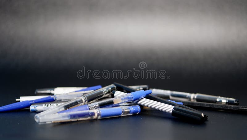 Black and Blue ink Pen set stock image. Image of wood - 279865017