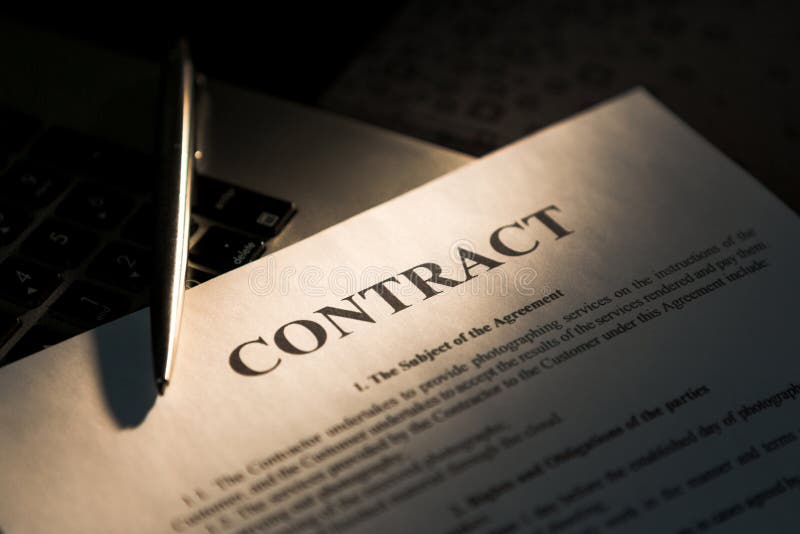 Pen for Signing the Contract. the Pen and Contract are on the Laptop ...