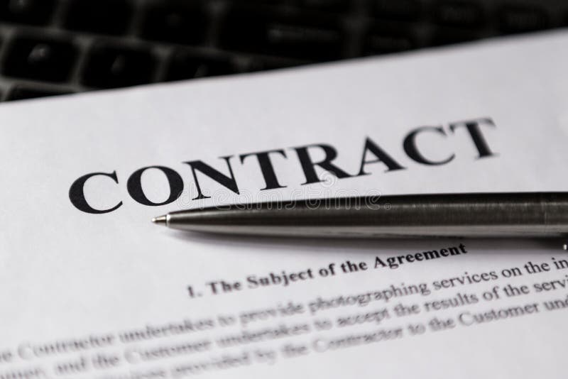 Pen for Signing the Contract. the Pen and Contract are on the Laptop ...