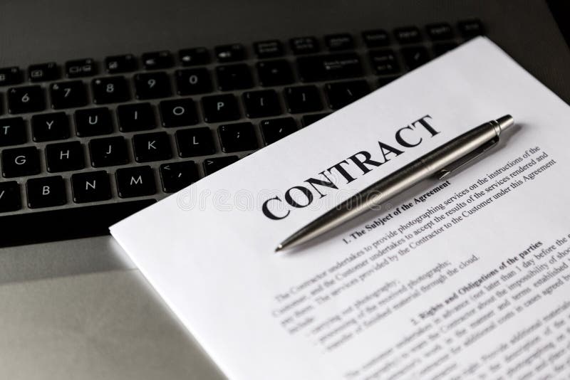 Pen for Signing the Contract. the Pen and Contract are on the Laptop ...
