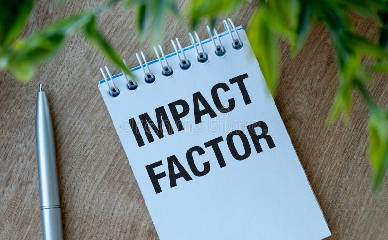 A Pen Sits on a Notebook with the Word Impact Written on it Stock Image ...
