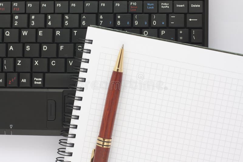 Pen and Spiral Notepad on Black Laptop Keyboard Stock Photo - Image of ...