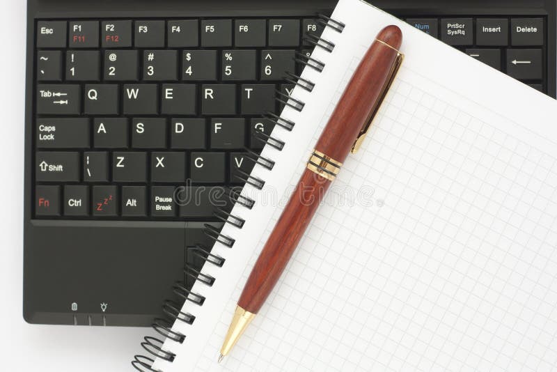 Pen and Spiral Notepad on Black Laptop Keyboard Stock Photo - Image of ...