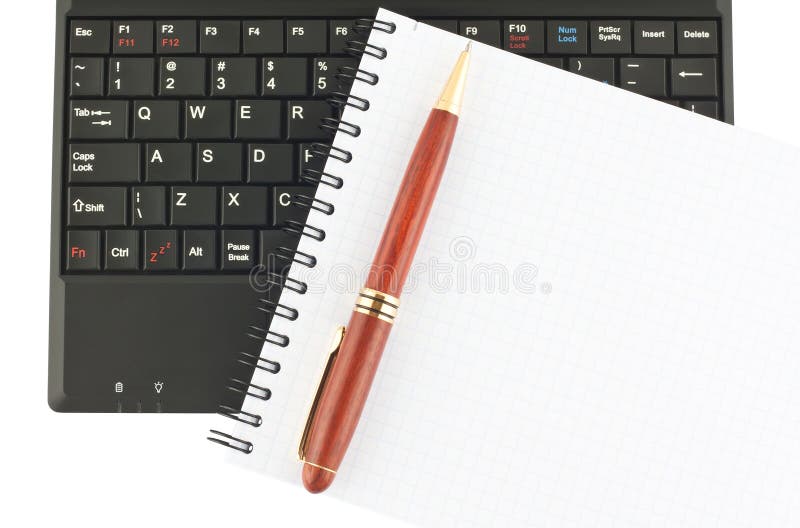 Pen and Spiral Notepad on Laptop Keyboard Stock Image - Image of ...