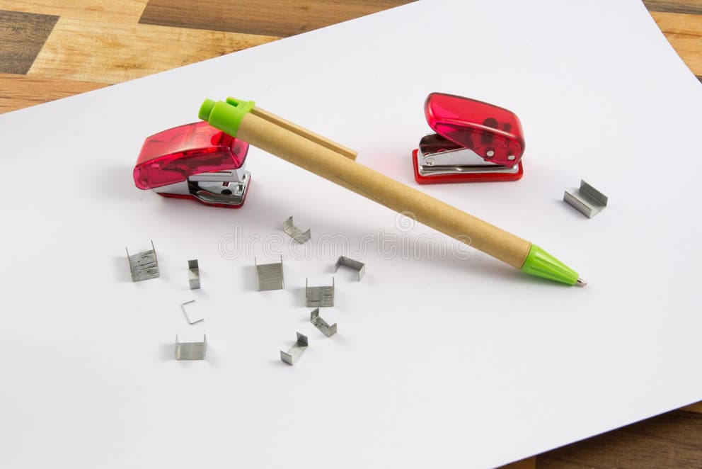 Pen and Stapler in a White Paper Stock Image - Image of blank, stapler ...