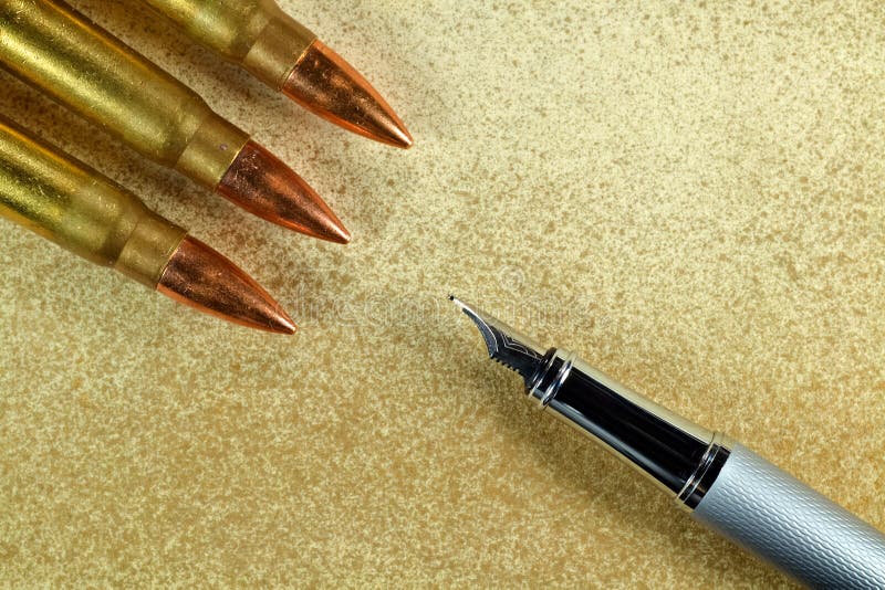 Pen and three bullets stock photo. Image of assault, freedom - 49578038