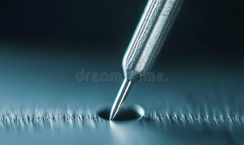 A Pen Tip Creates a Small Hole in a Surface, Highlighting Precision and ...